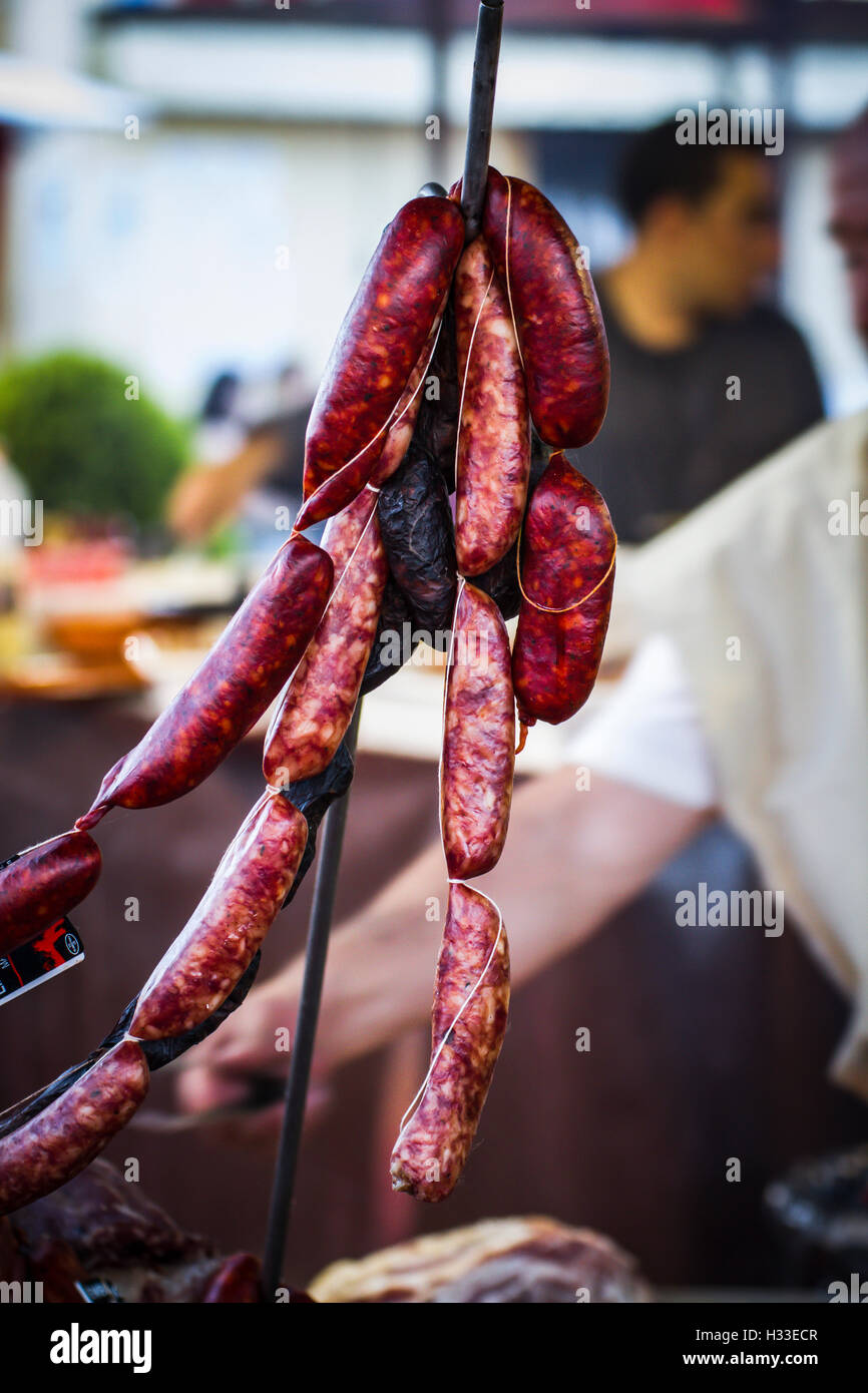 lots of sausages and chorizos in a medieval fair Stock Photo - Alamy
