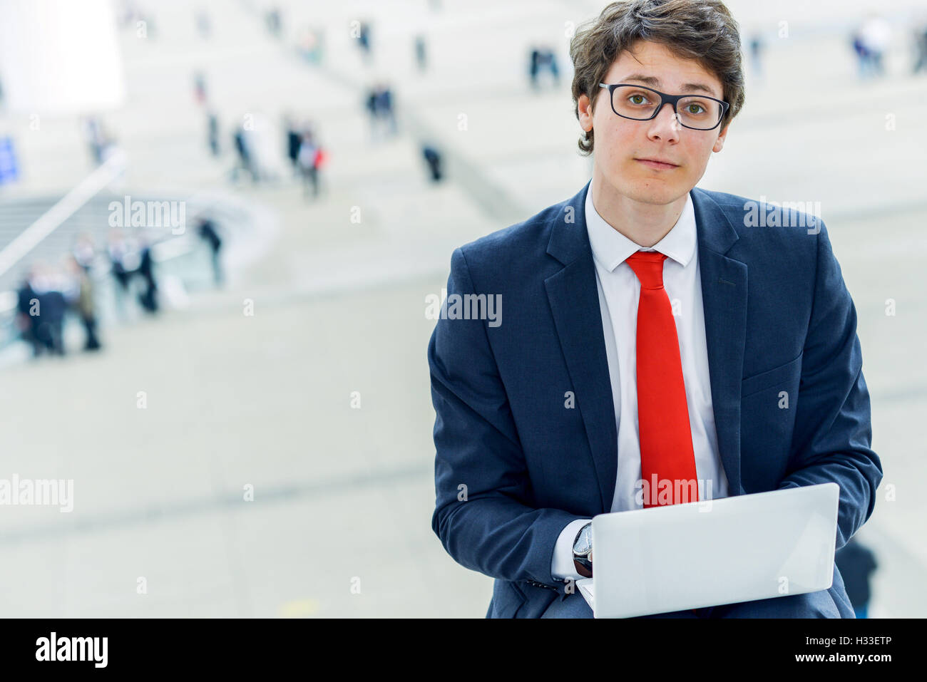 Junior executive dynamic working outside of his office Stock Photo - Alamy
