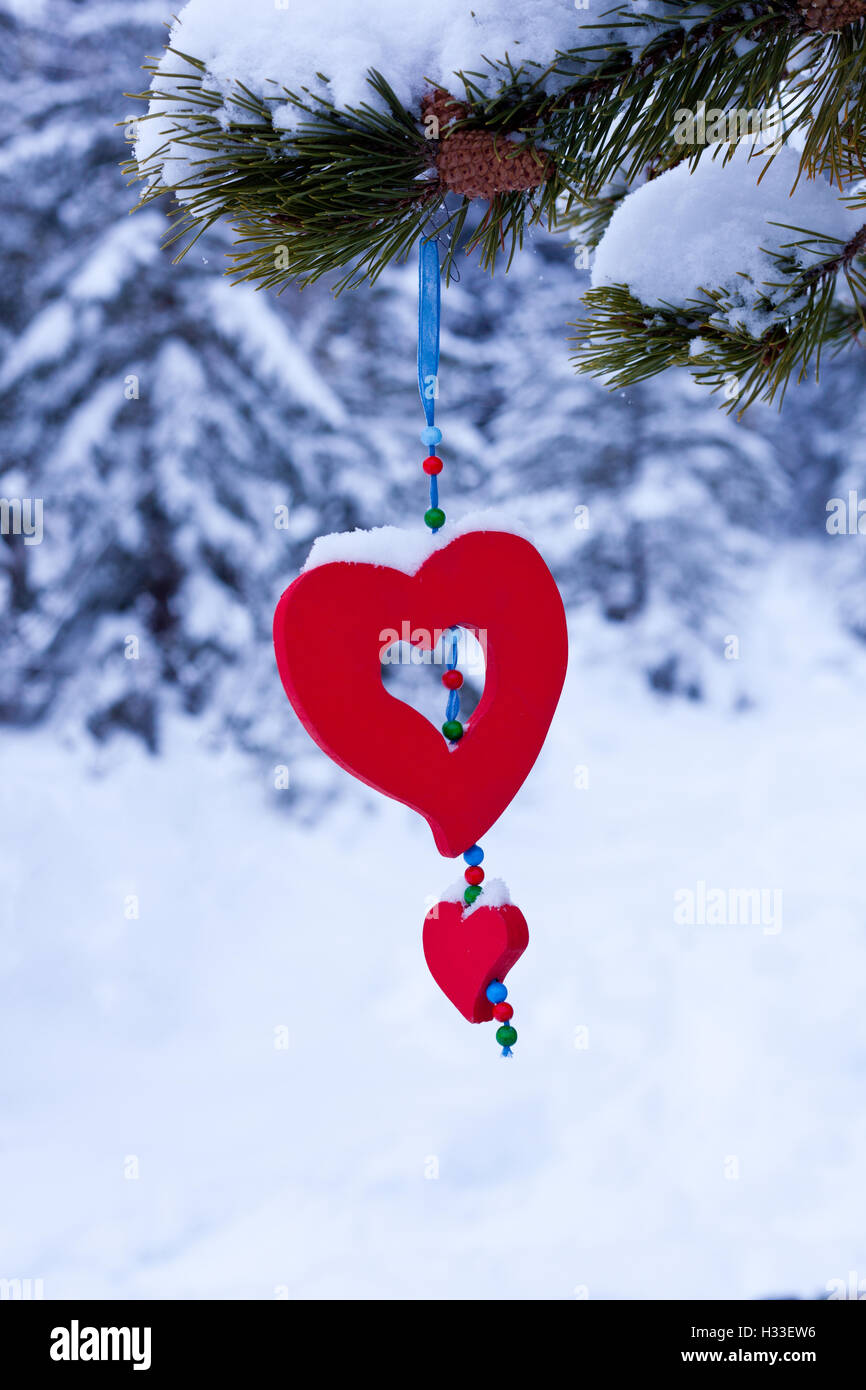 Red heart pine christmas ornament winter forest Stock Photo - Alamy