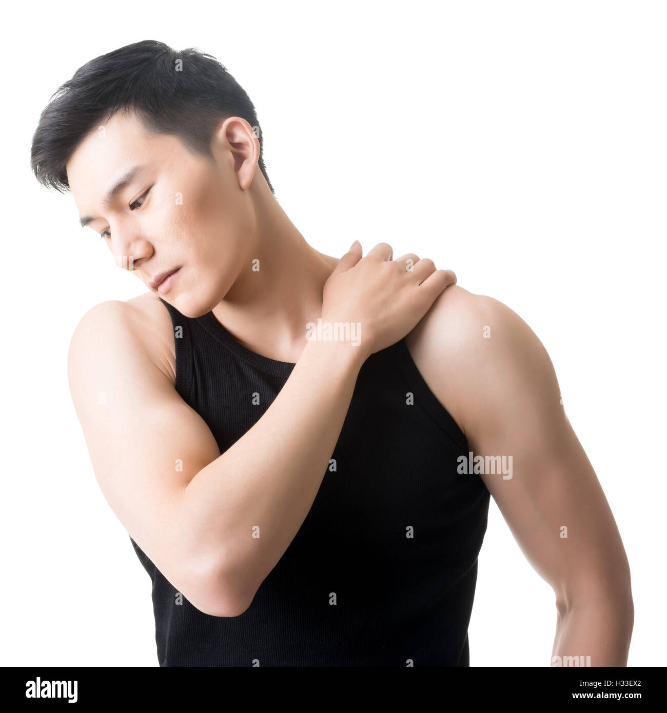 Asian young man having shoulder pain Stock Photo - Alamy