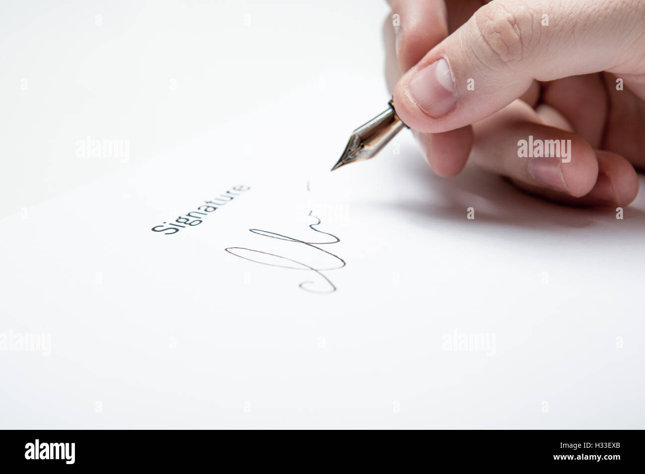 pen in the man's hand and signature Stock Photo - Alamy