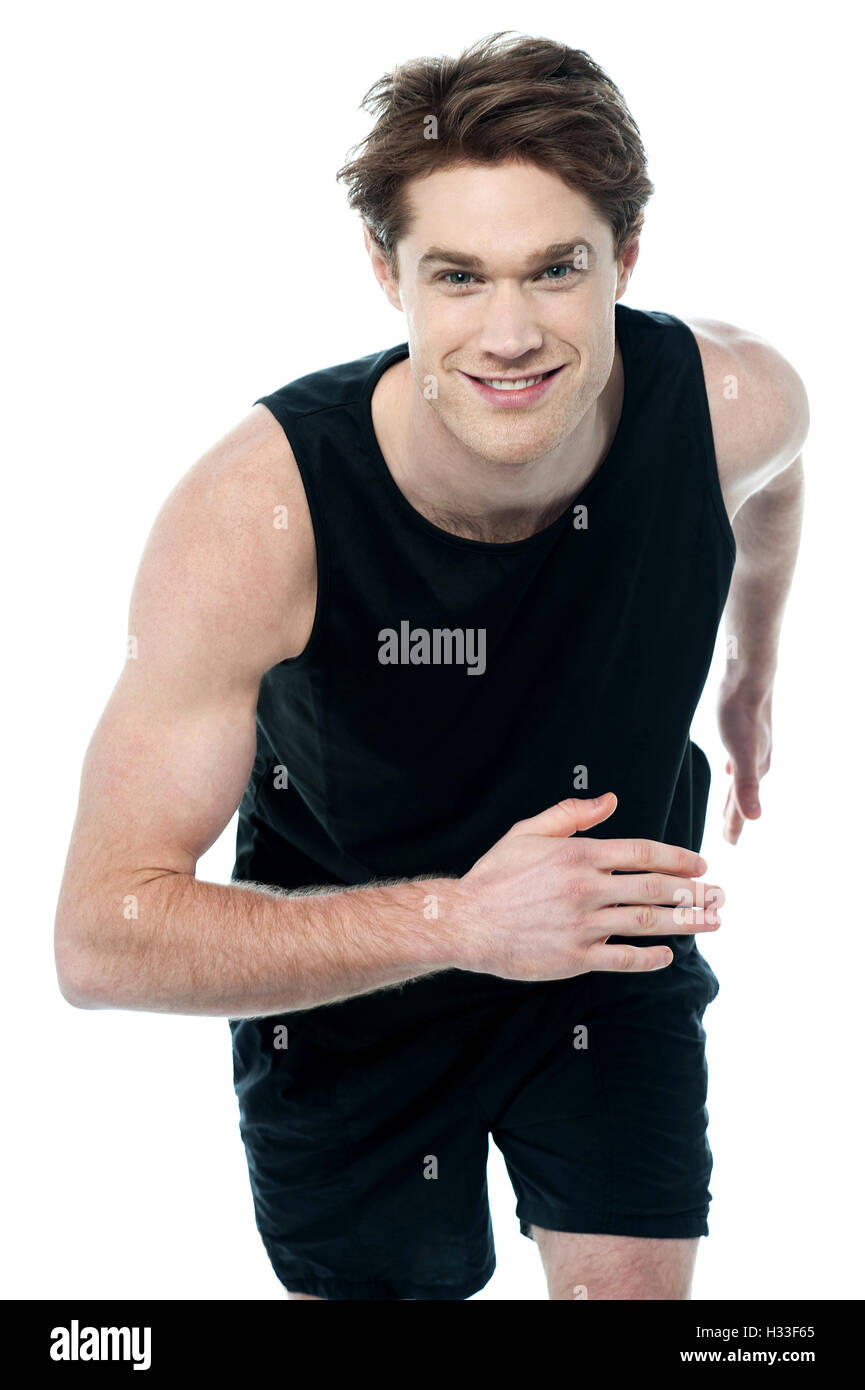 Smiling sportive man running Stock Photo - Alamy