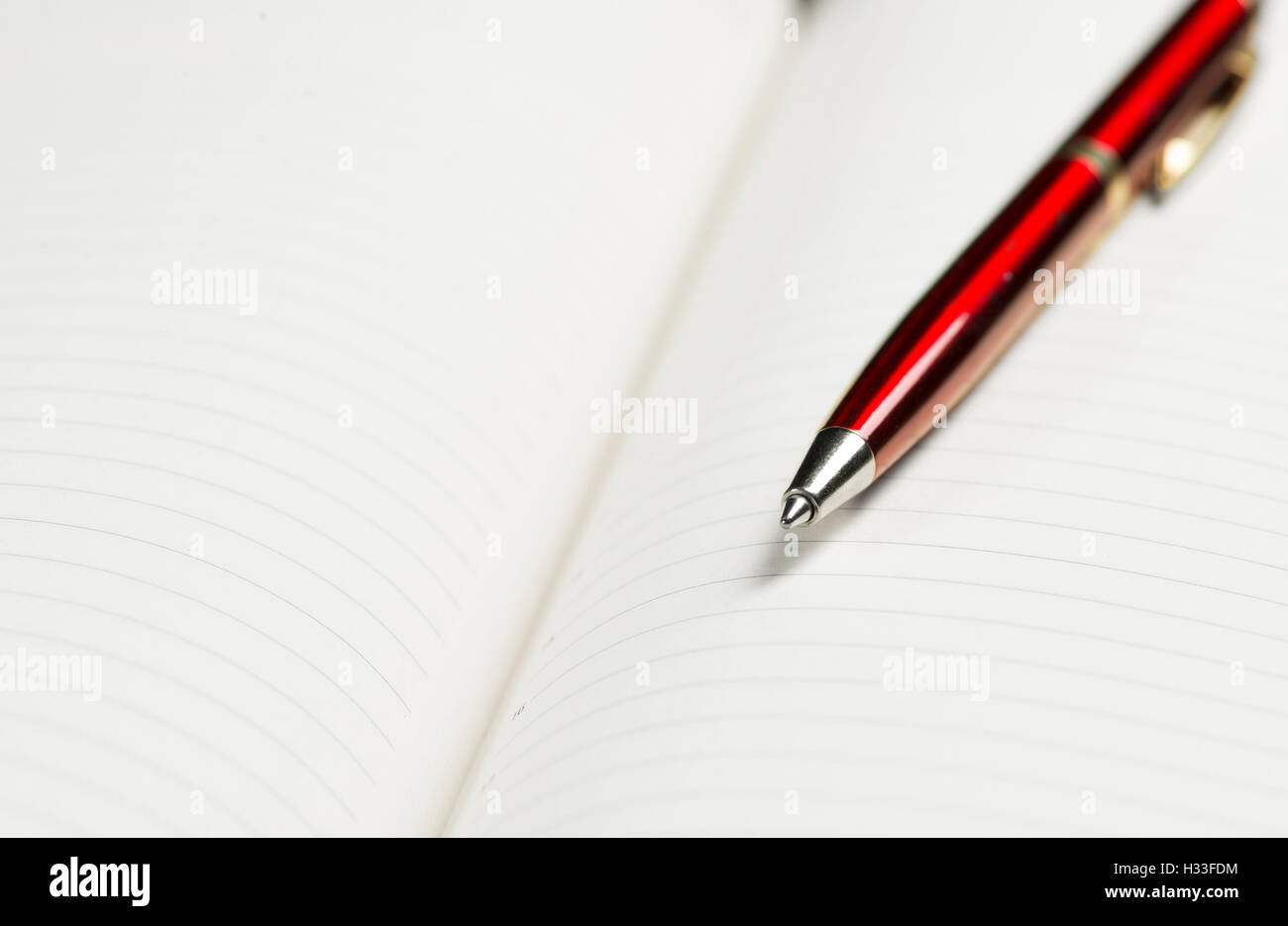 pen and open notepad Stock Photo - Alamy