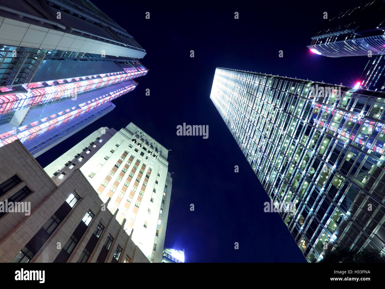 Modern building from low angle at night Stock Photo - Alamy