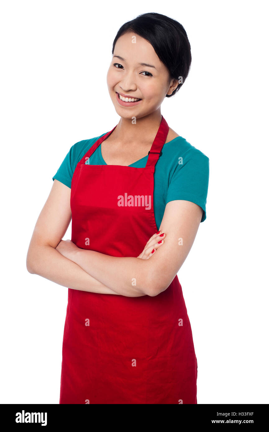 Pretty baker woman posing with arms folded Stock Photo - Alamy