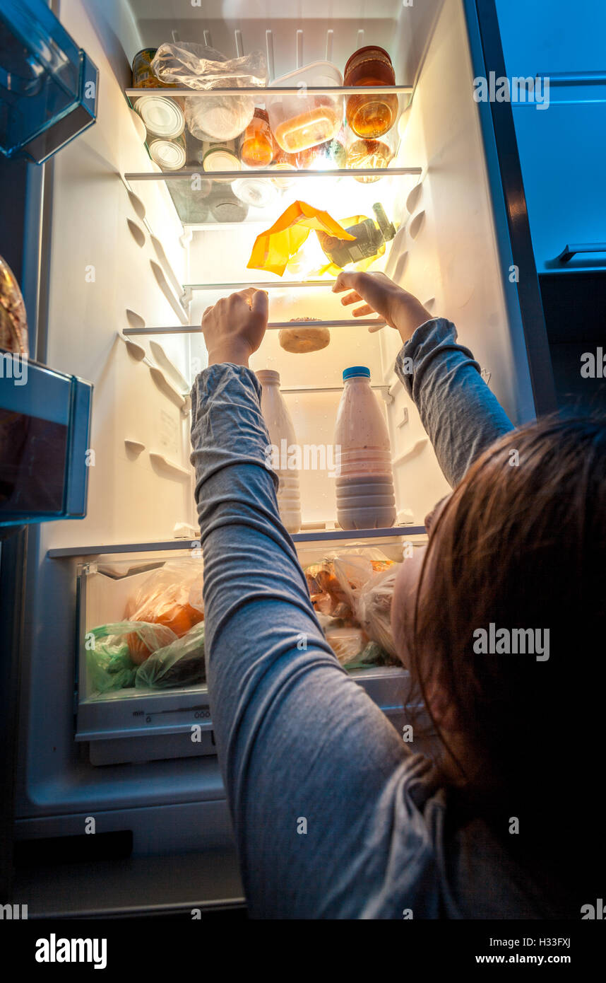 Lady reaching top shelf hi-res stock photography and images - Alamy