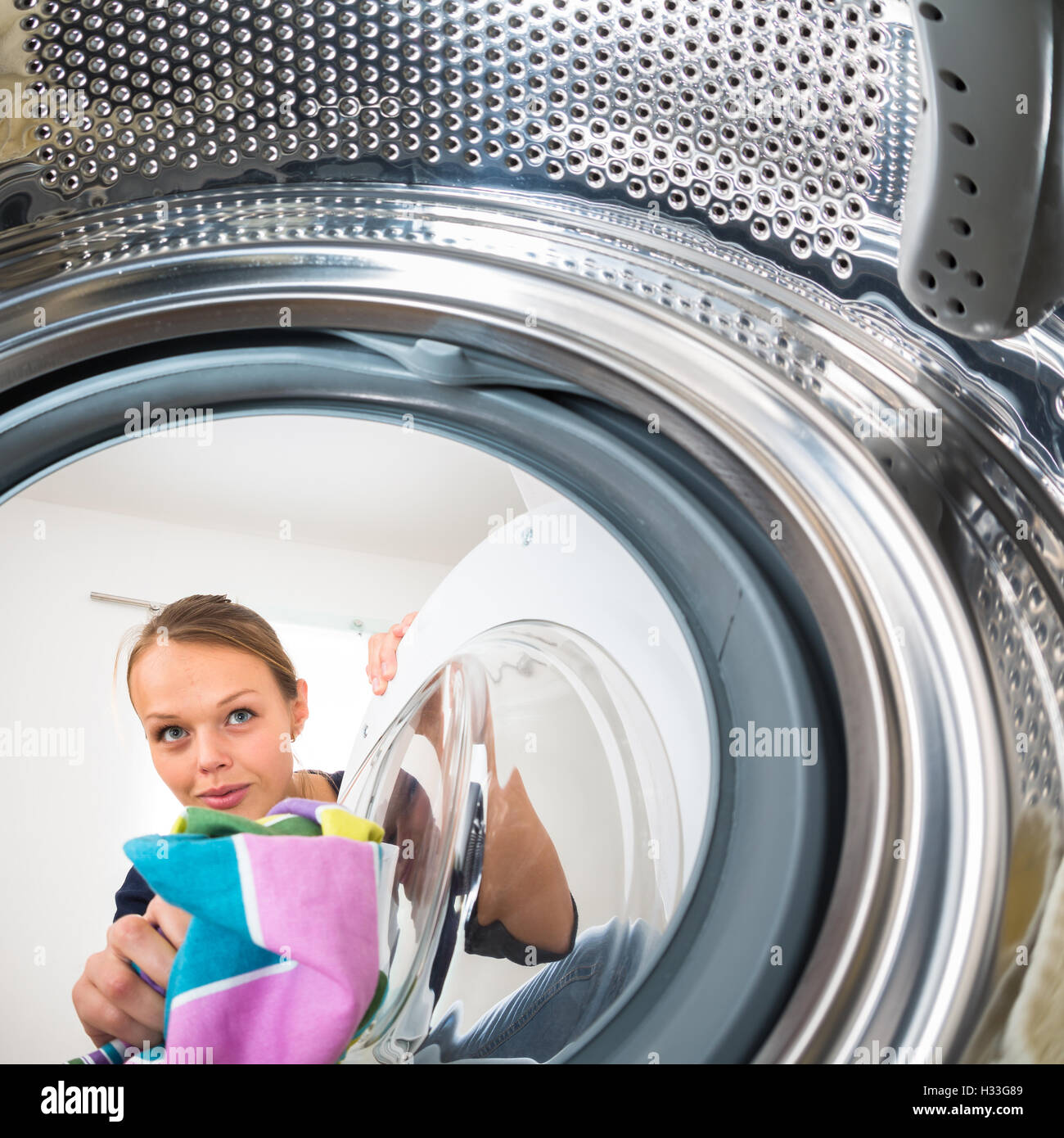 Housework: young woman doing laundry Stock Photo - Alamy