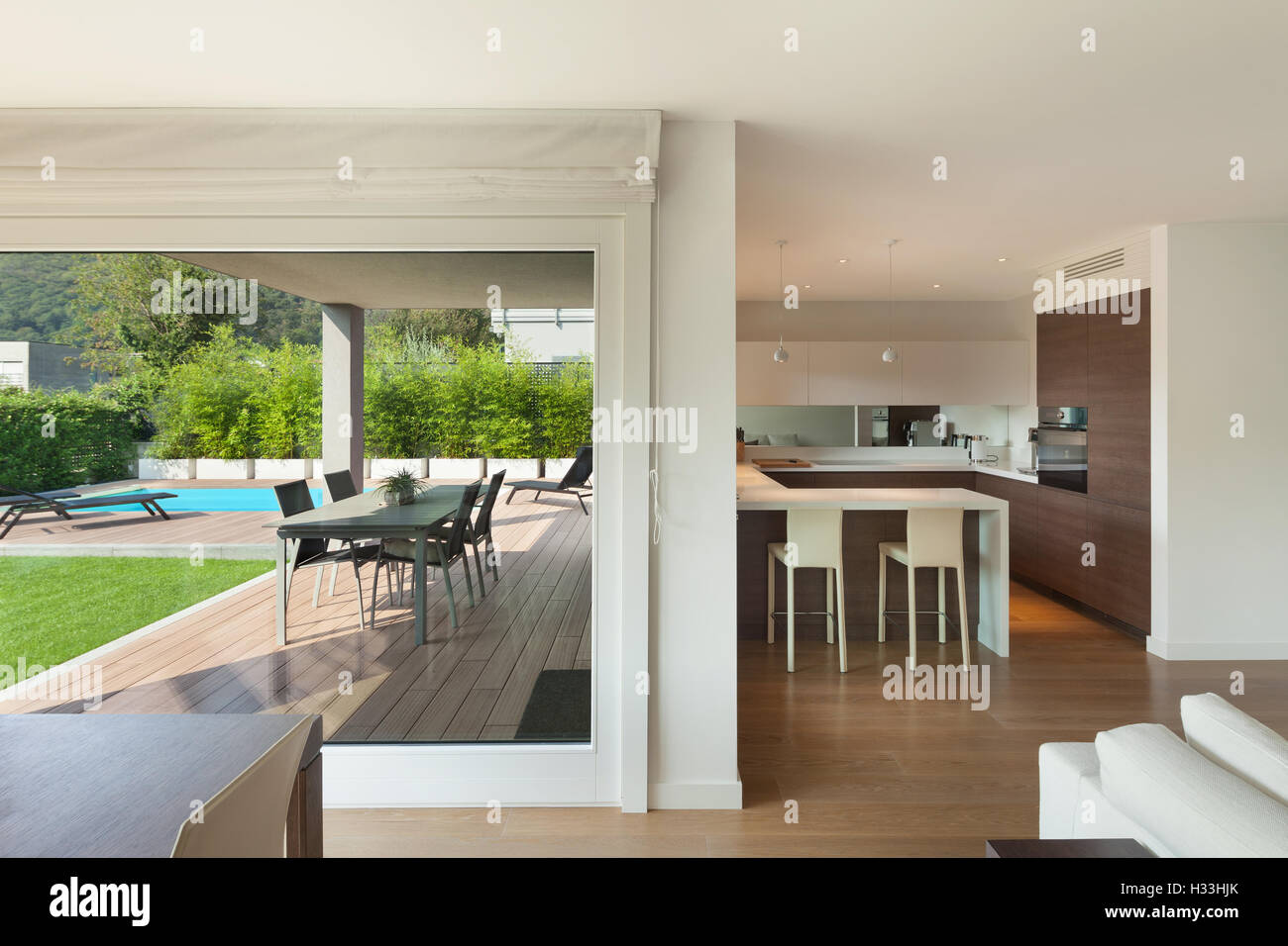 Luxury home interior, wide open space, veranda and garden view from the ...