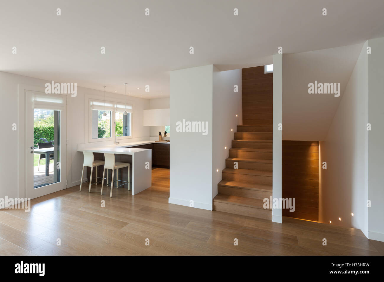 Luxury house interior, modern kitchen and wide hall Stock Photo - Alamy