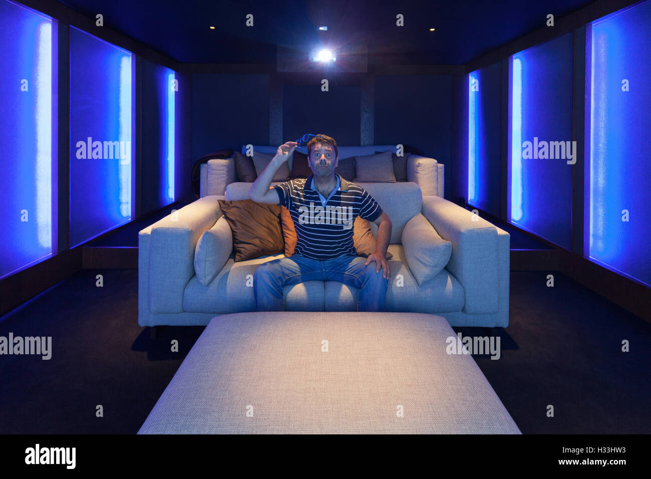 Man watching tv in a modern home hi-res stock photography and images ...