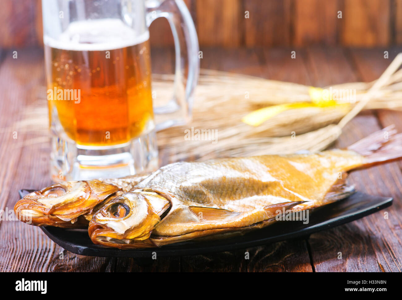 smoked fish on plate and on a table Stock Photo - Alamy