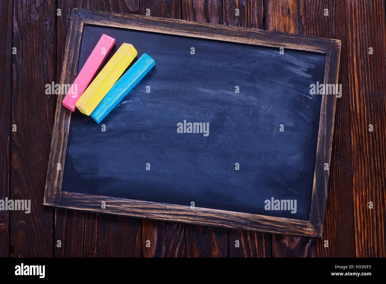 black board and chalk on a table Stock Photo - Alamy