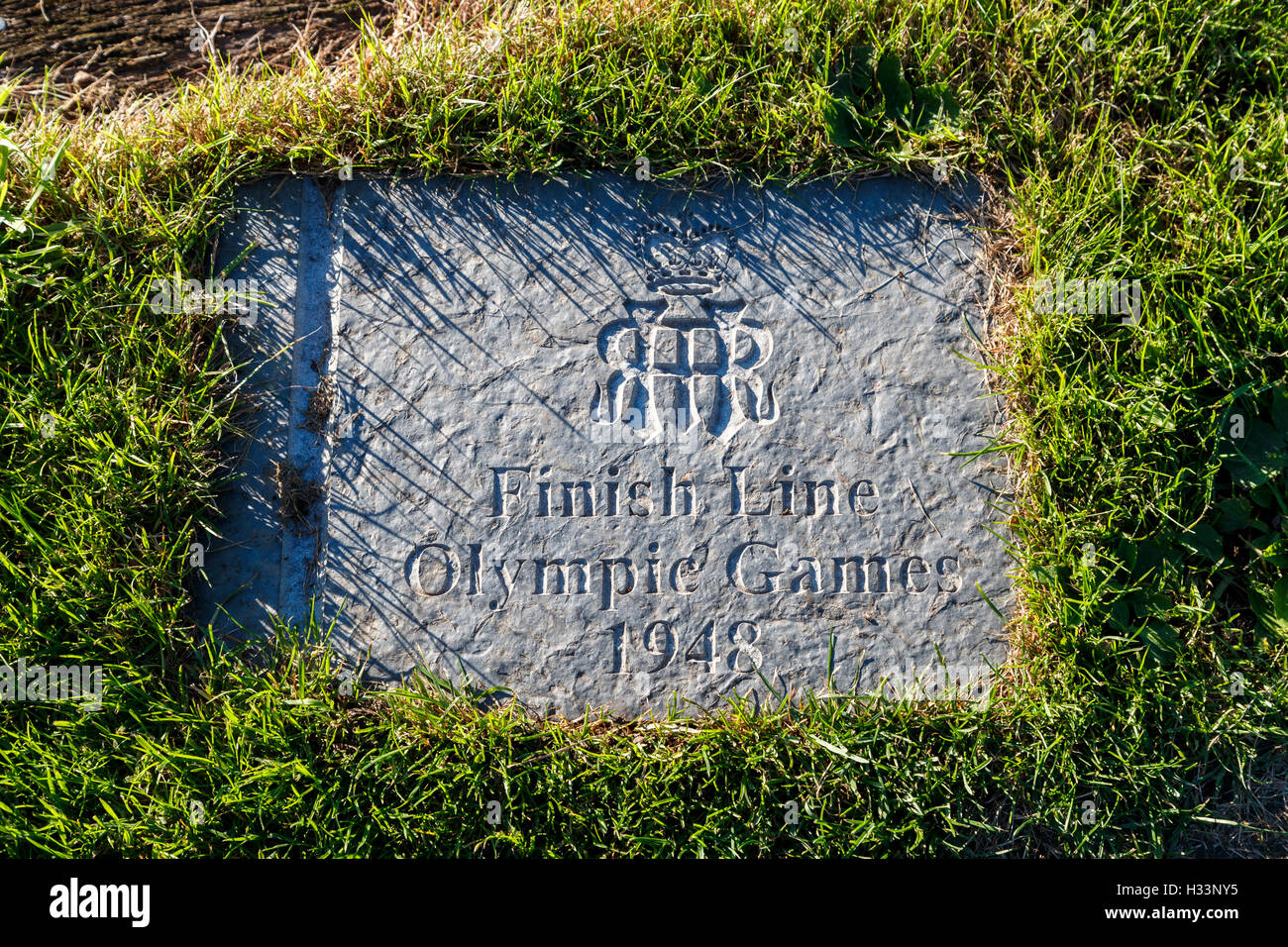 Plaque on the river bank marking the rowing finish line at the Olympic ...