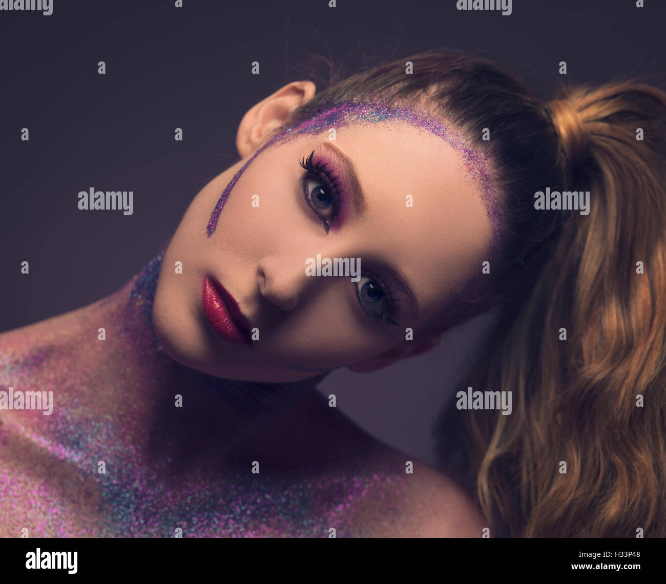 Girl wearing glitter makeup Stock Photo - Alamy