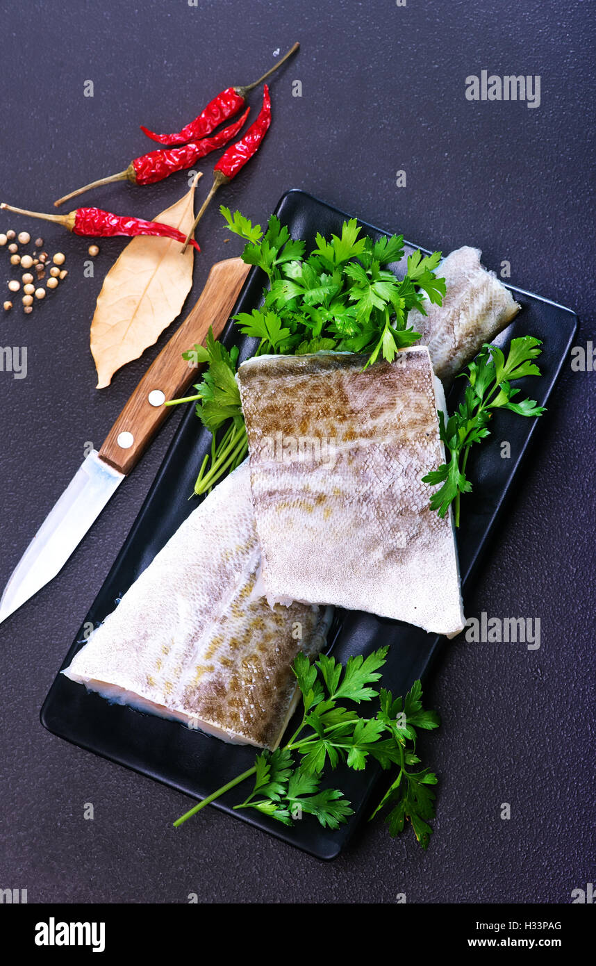 raw fish fillet and aroma spice on a table Stock Photo - Alamy