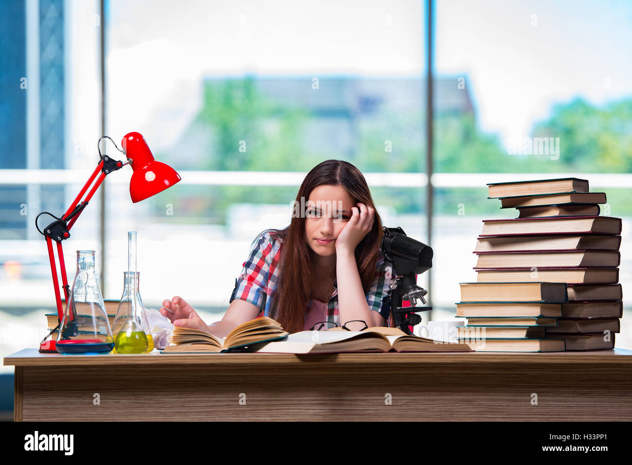 Sad student preparing for chemistry exams Stock Photo - Alamy