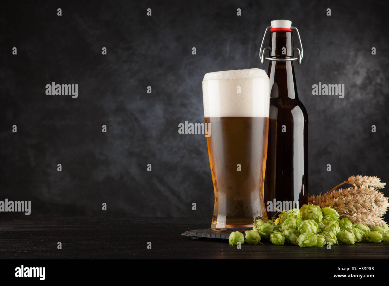 Beer glass on dark background Stock Photo - Alamy