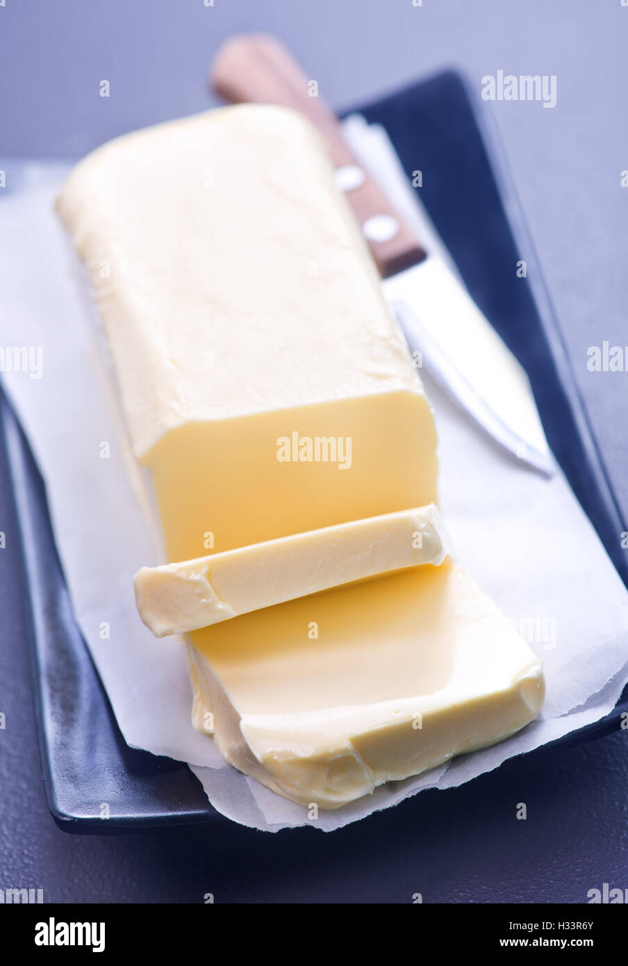butter on plate and on a table Stock Photo - Alamy
