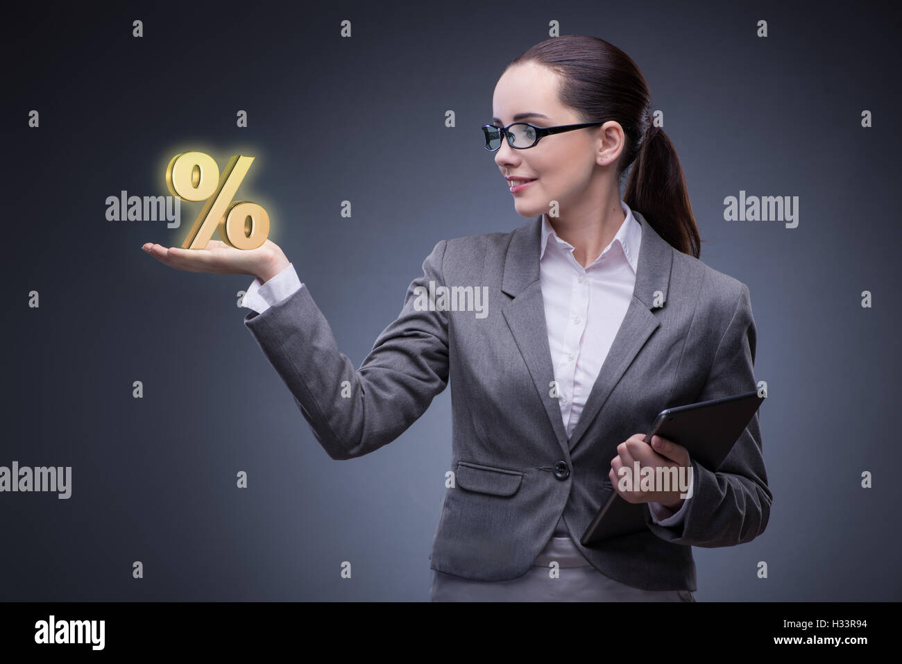 Businesswoman in high interest rates concept Stock Photo - Alamy