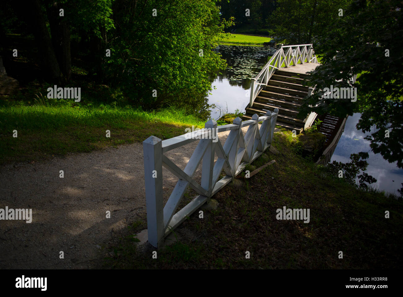 A small bridge over a pond Stock Photo - Alamy