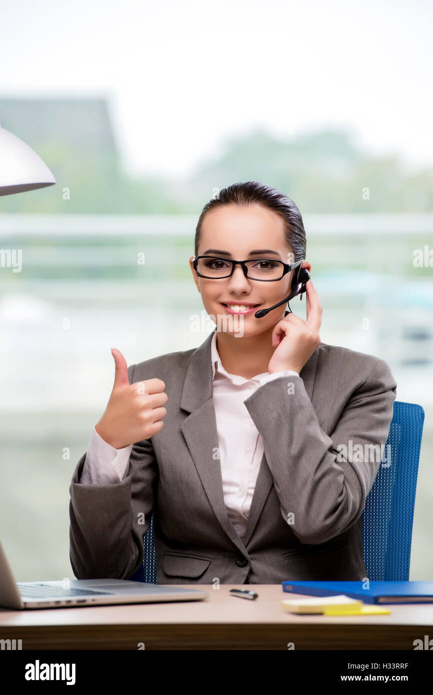 Call center operator working at her desk Stock Photo - Alamy
