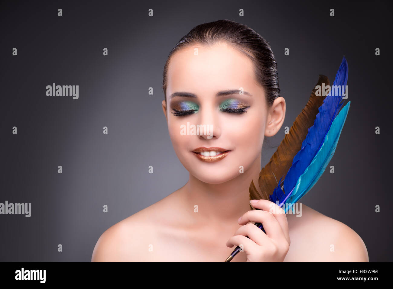 Beautiful woman with writing feather quill Stock Photo - Alamy