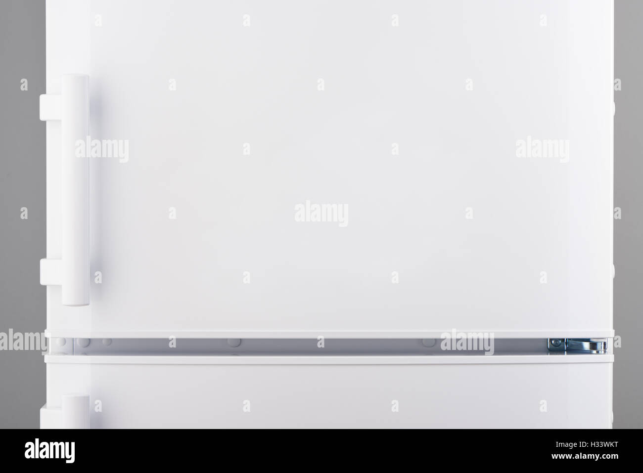 White refrigerator on gray background Stock Photo - Alamy