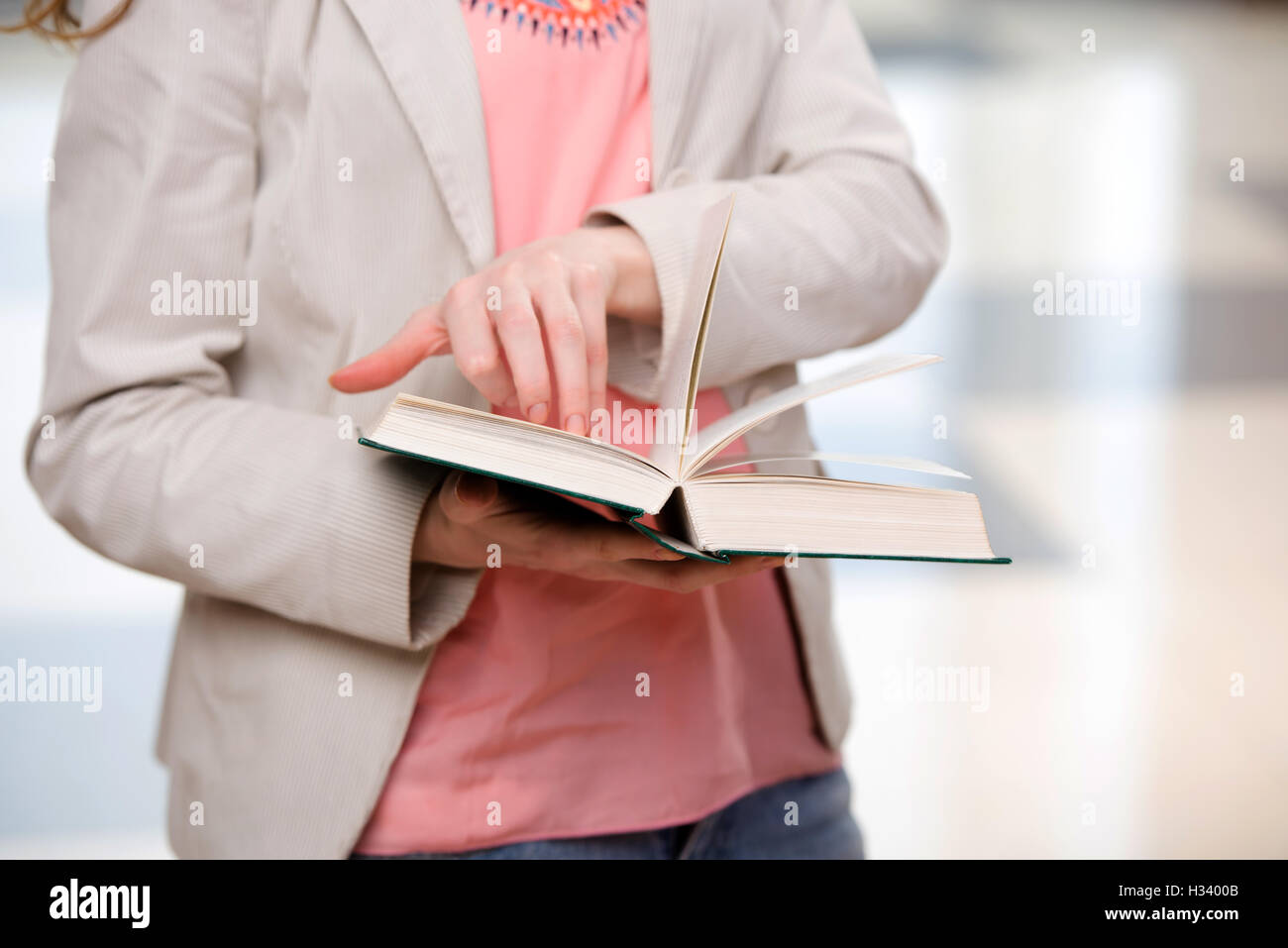 Young student reading book in preparation for exams Stock Photo - Alamy
