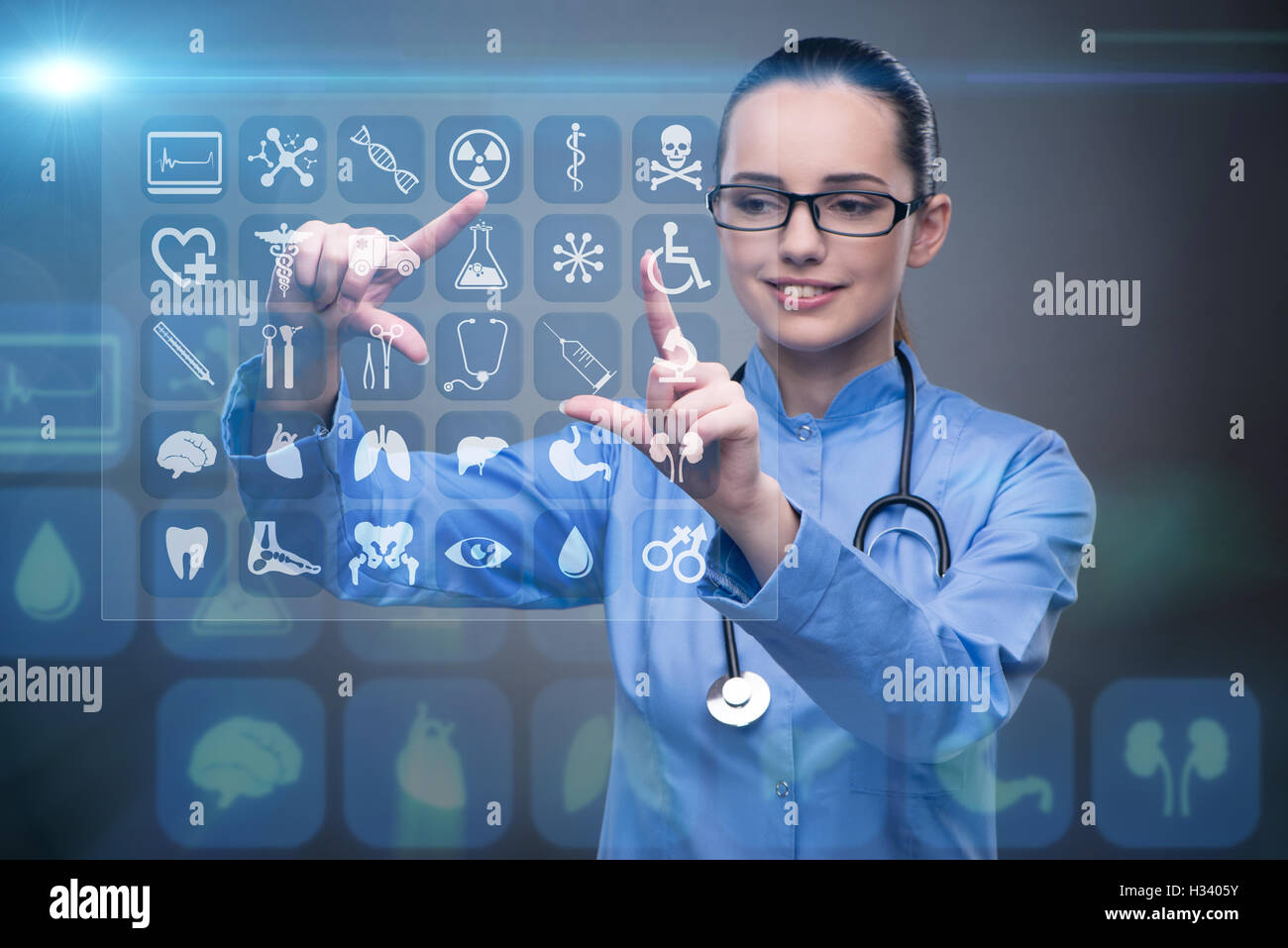 Woman doctor pressing buttons with various medical icons Stock Photo ...
