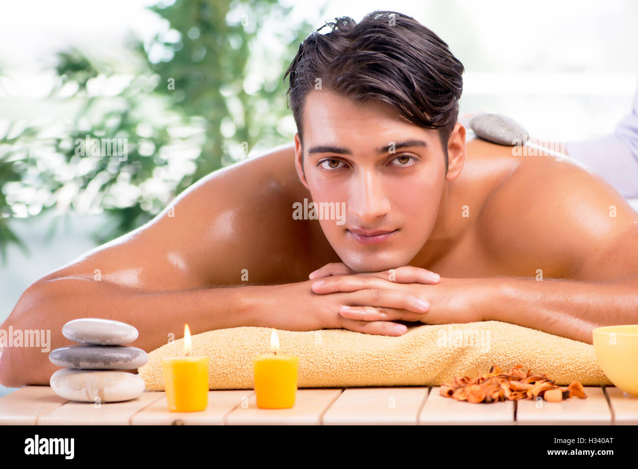 Young handsome man during spa procedure Stock Photo - Alamy
