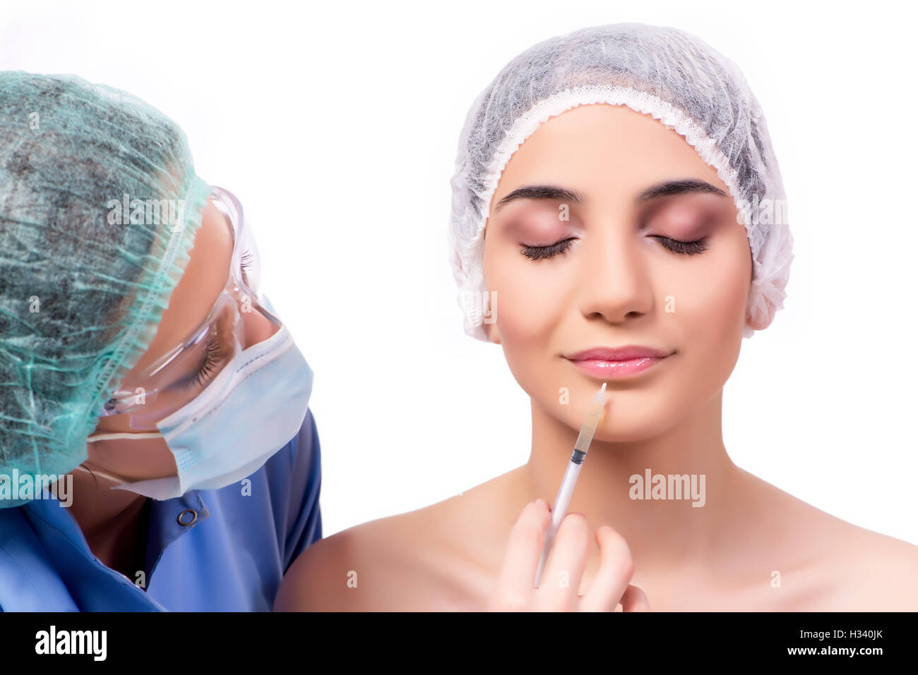 Young woman preparing for plastic surgery isolated on white Stock Photo ...