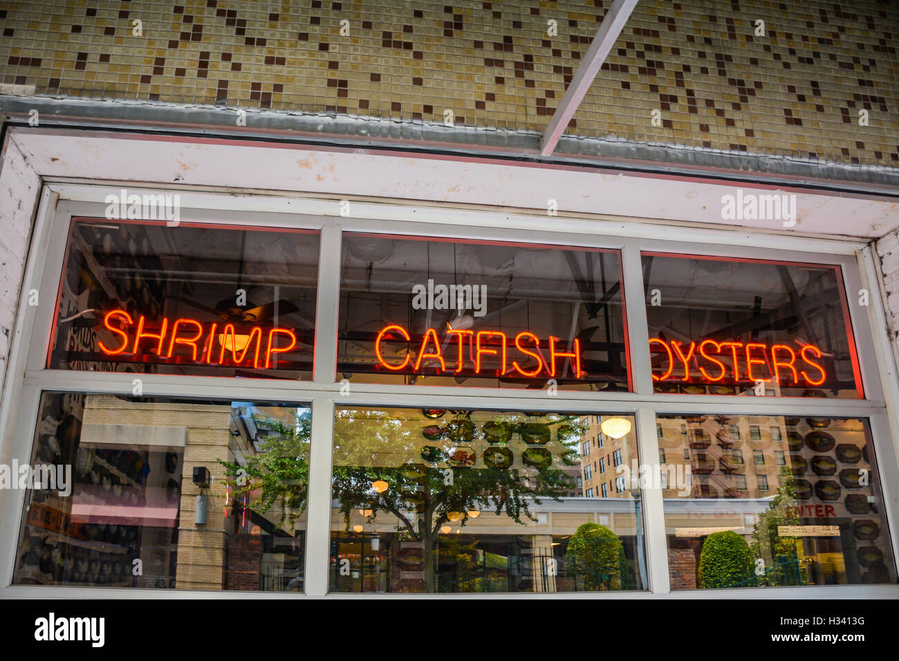 An old Restaurant 's storefront windows with Neon signs reading Shrimp ...