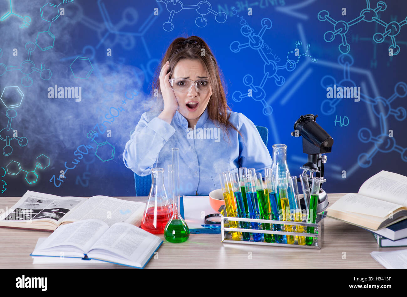 Scared woman chemist after unsuccessful chemical experiment Stock Photo ...