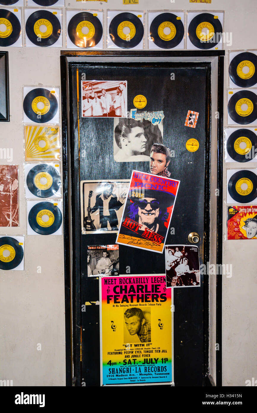 A wall and door covered in 45rpm records with fliers and posters on ...