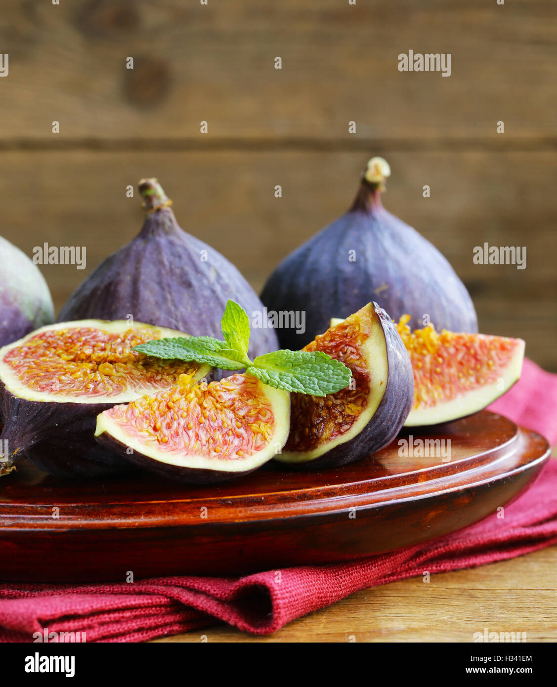 Natural ripe figs on a wooden board Stock Photo - Alamy