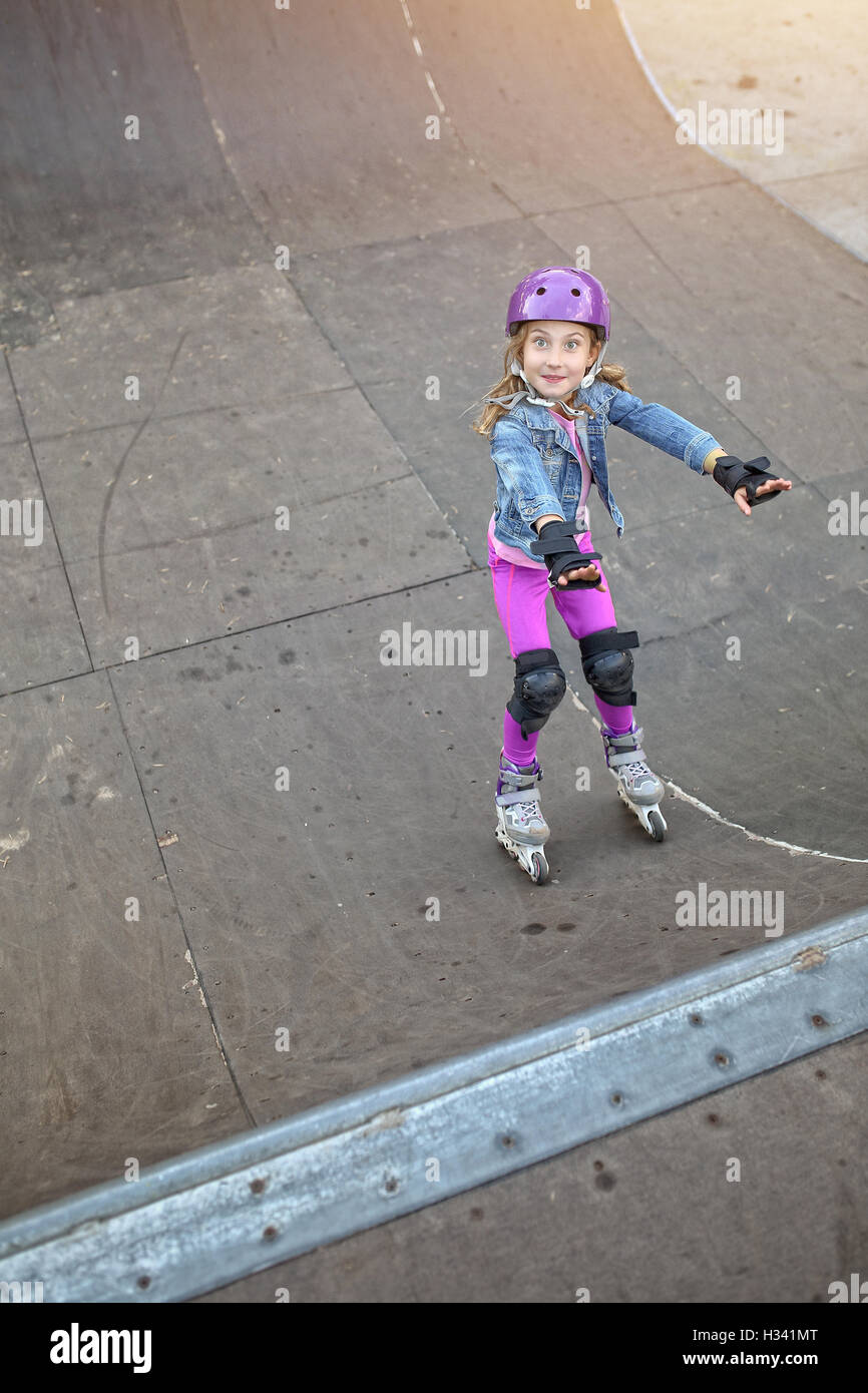 young girl rides on rollers Stock Photo - Alamy