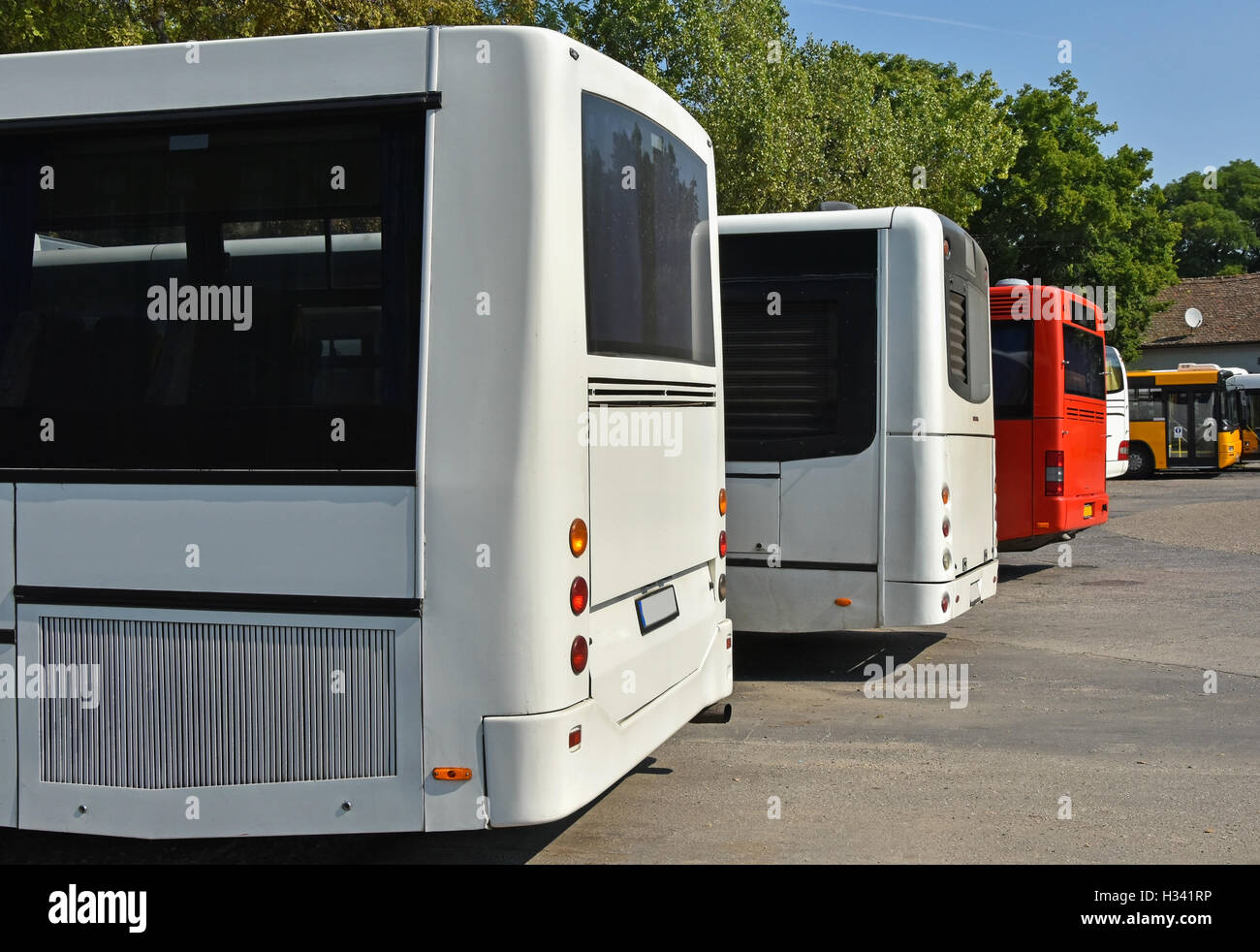 Buses in a row at the bus terminal Stock Photo - Alamy