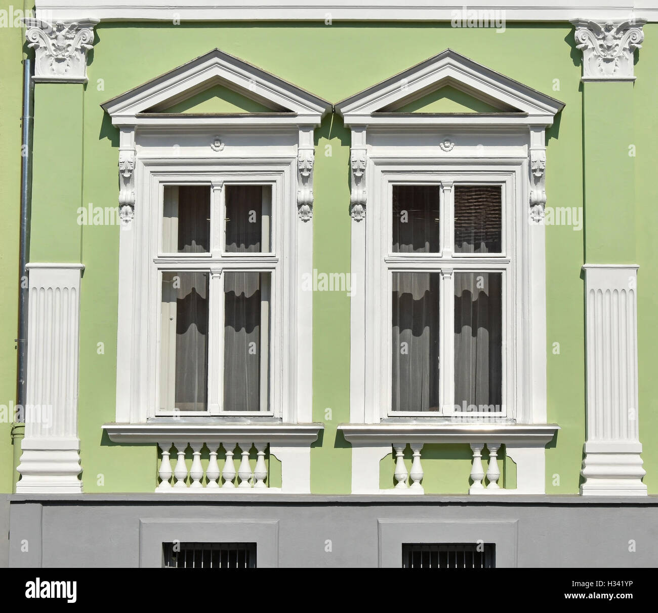 Ornate windows of a house in the city Stock Photo - Alamy