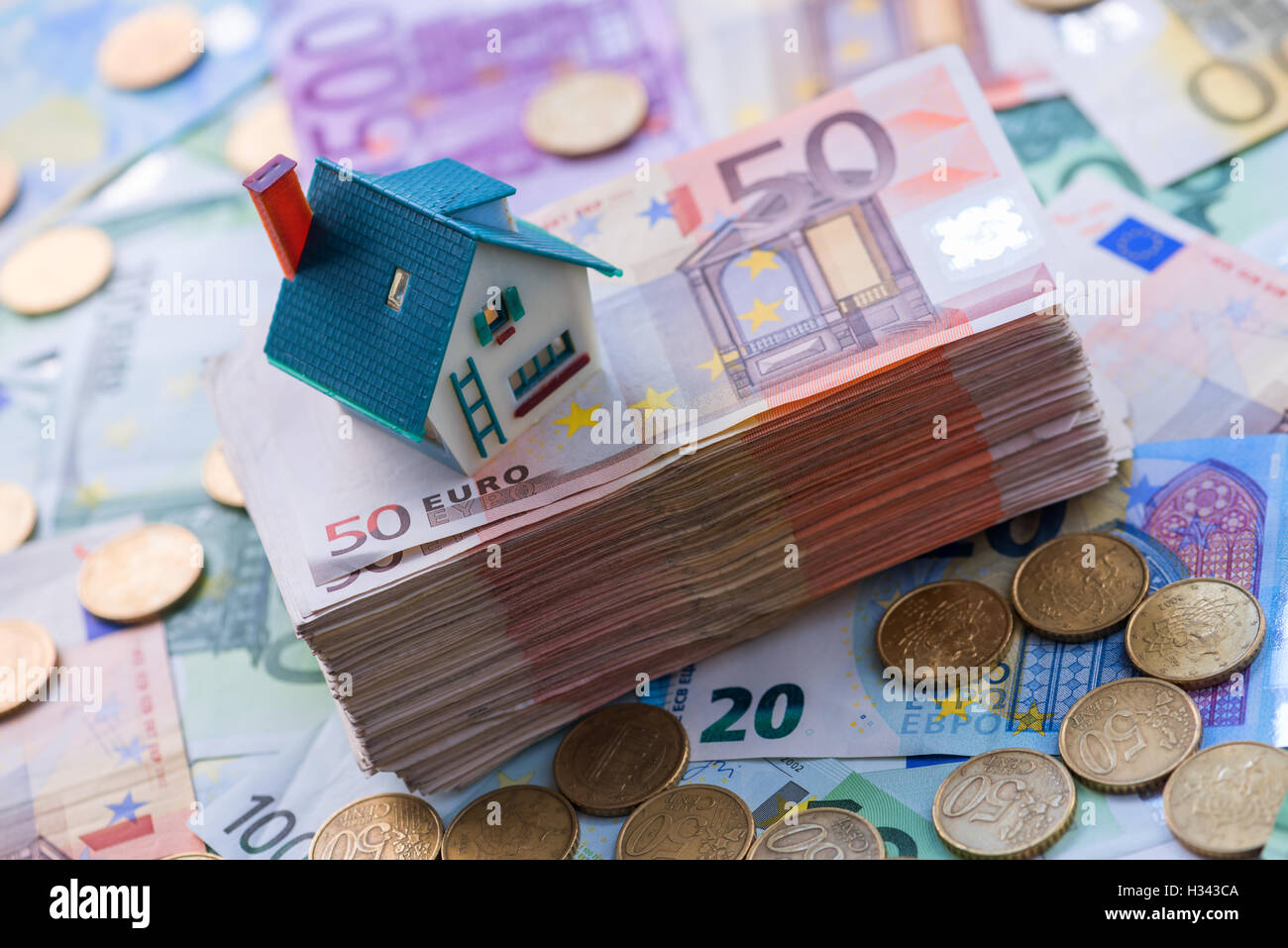 house model on euro cash stack closeup Stock Photo - Alamy