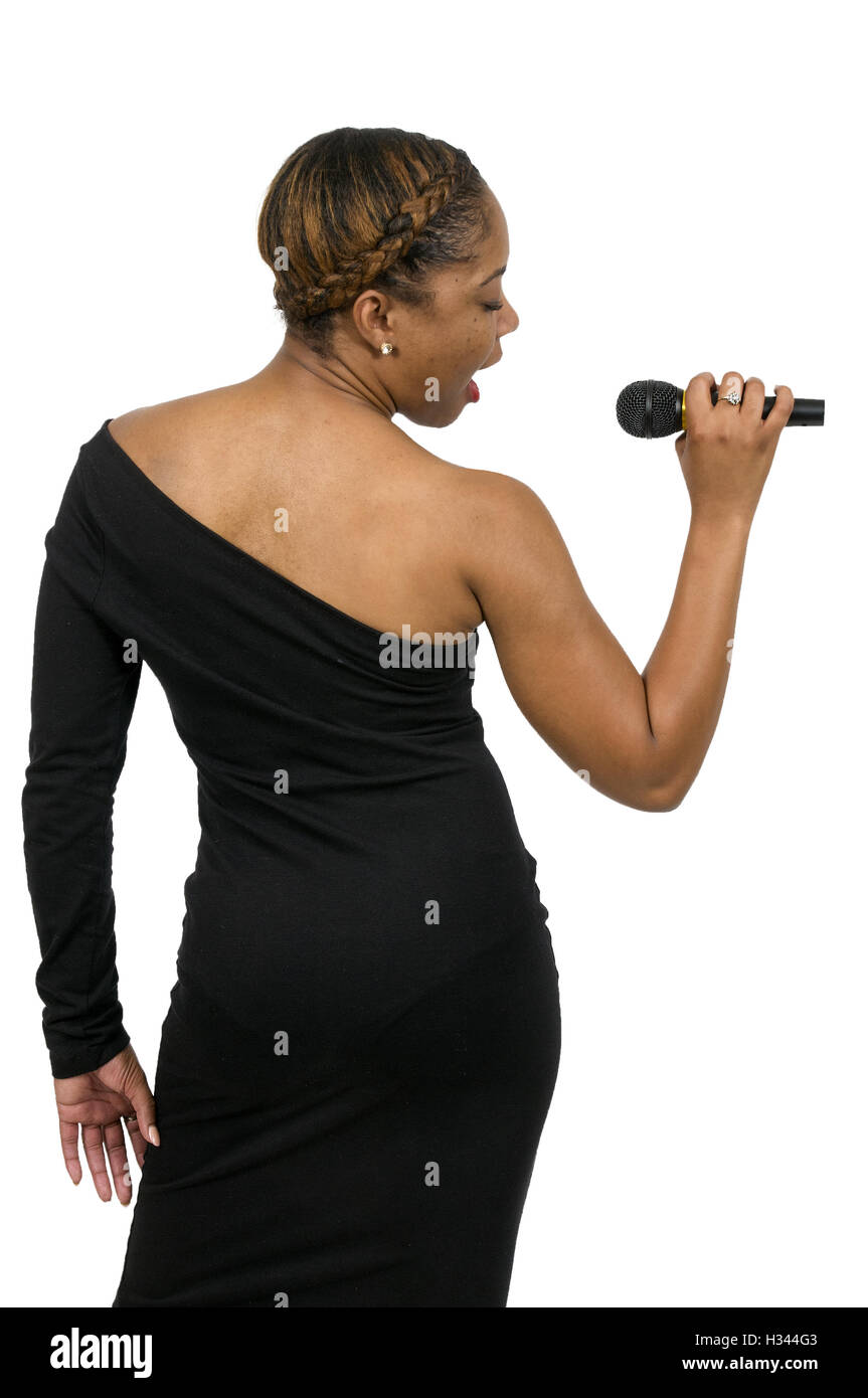 Beautiful woman singer performing at a concert Stock Photo - Alamy