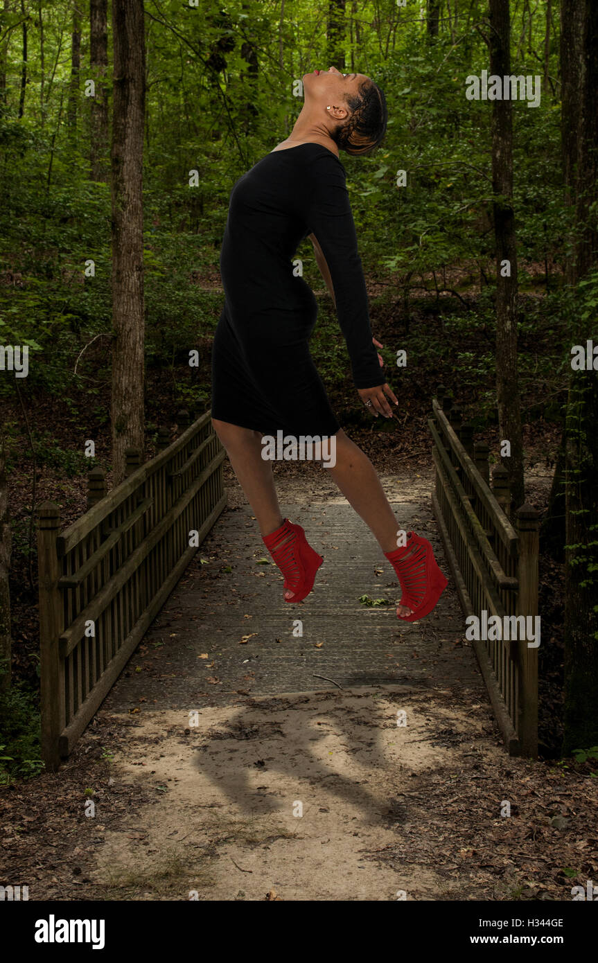 Beautiful young woman floating in the air Stock Photo - Alamy