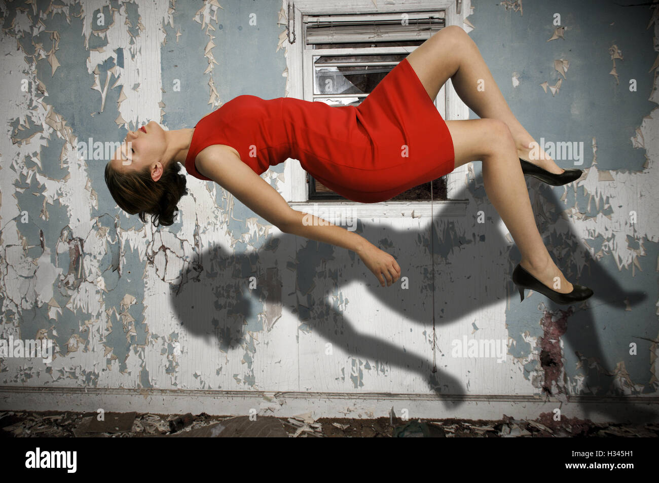 Beautiful young woman floating in the air Stock Photo - Alamy