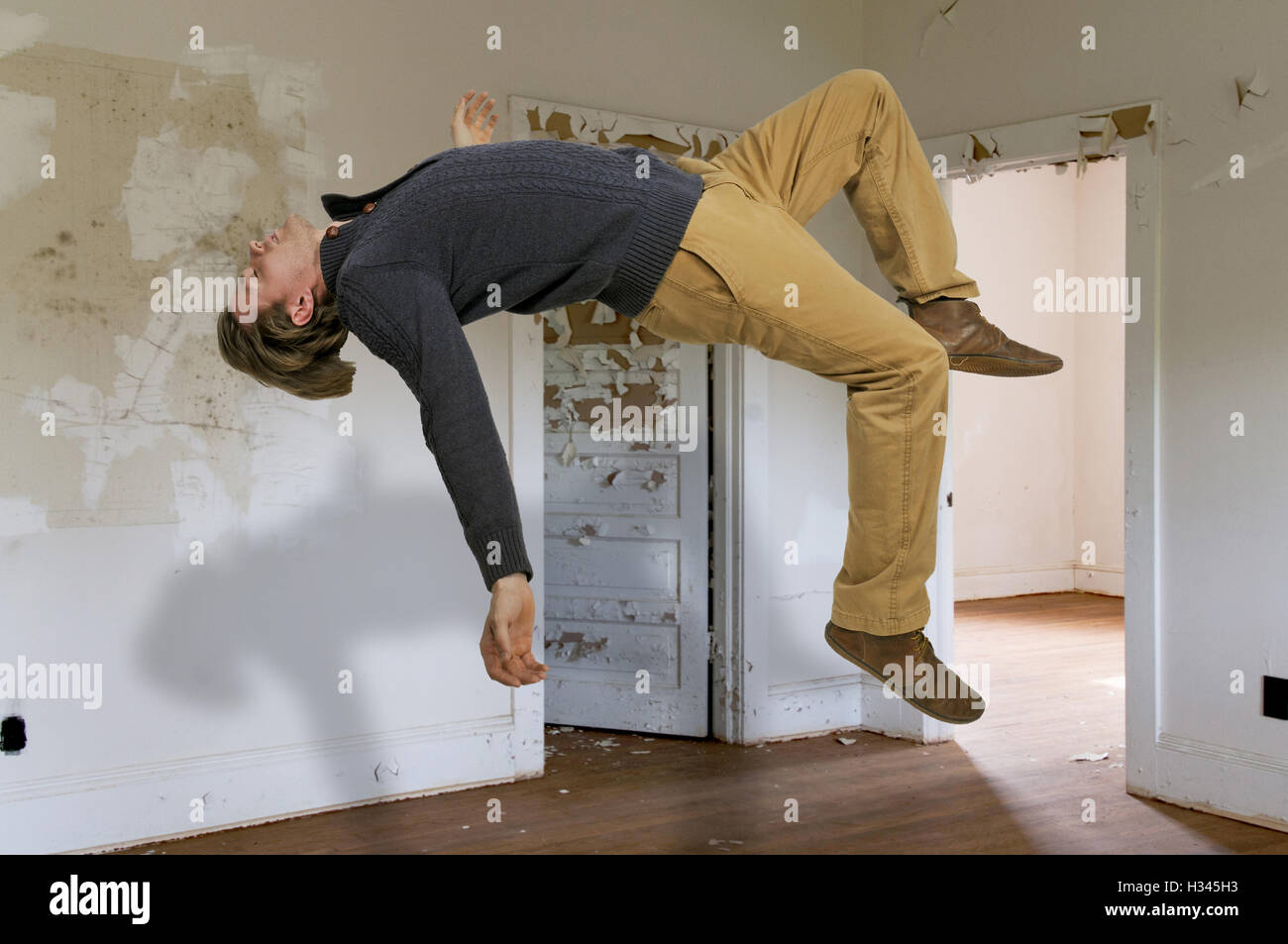 Handsome young man floating in the air Stock Photo - Alamy