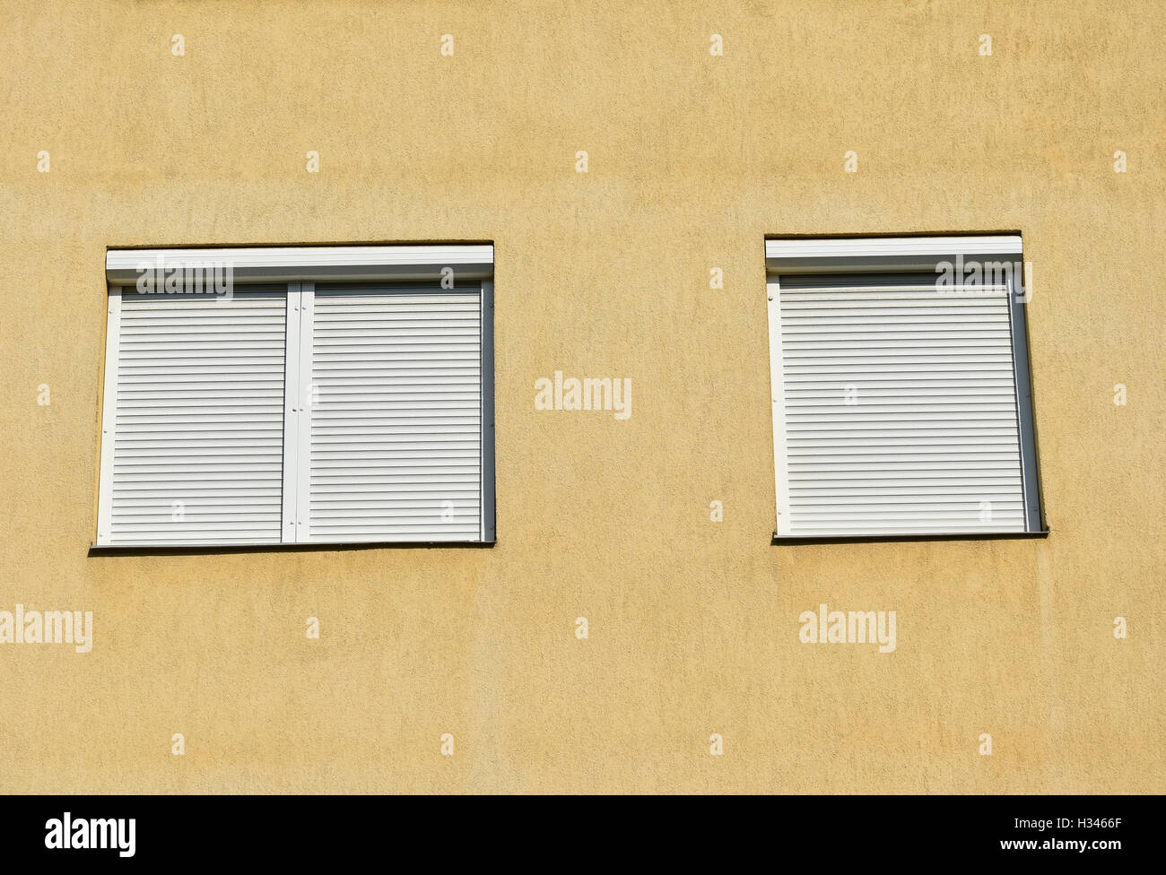 Closed shutters on the window on a building Stock Photo - Alamy