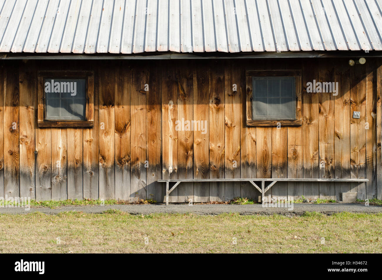 Exterior wall of old worn barn with bench Stock Photo - Alamy