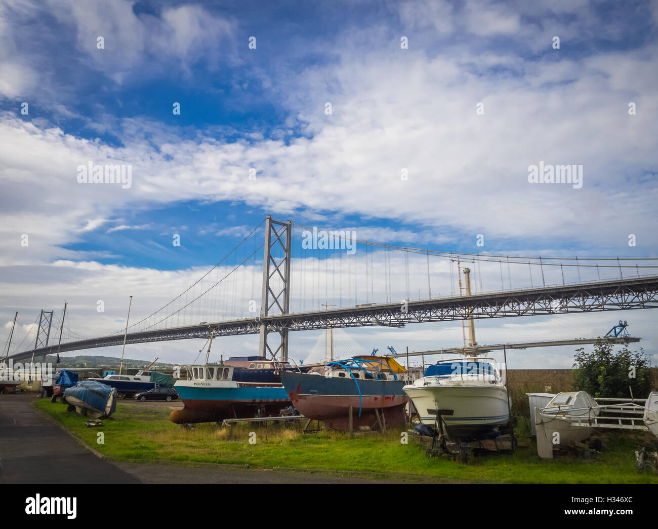 Boats in front of the Forth Road Bridge in Edinburgh, Scotland ...