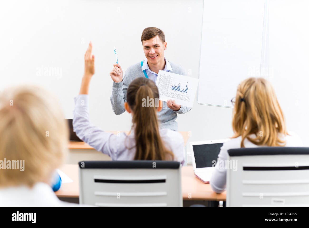 teacher talking with students Stock Photo - Alamy