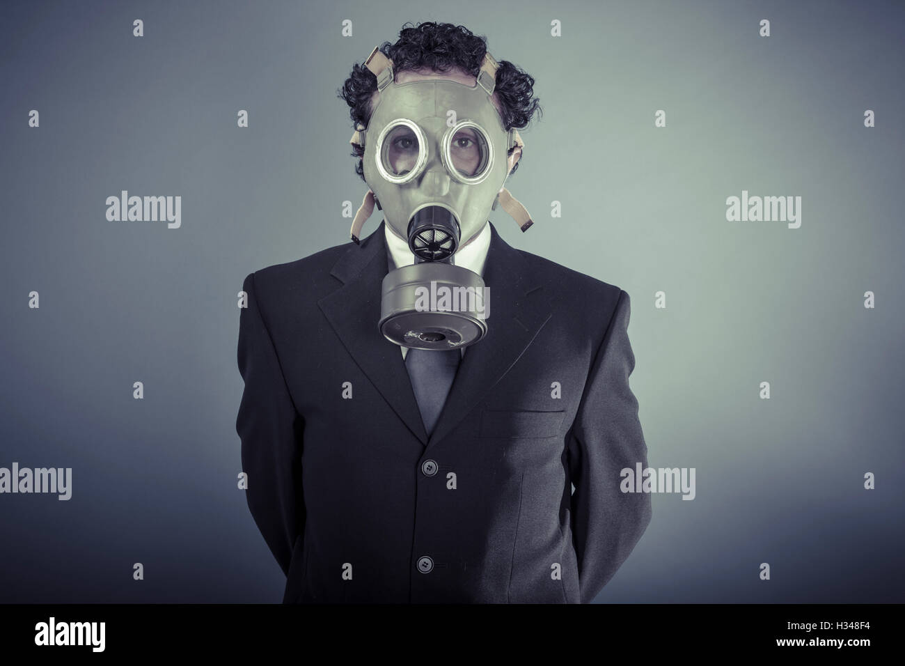Hazard, Business man wearing a gask mask, pollution concept Stock Photo ...