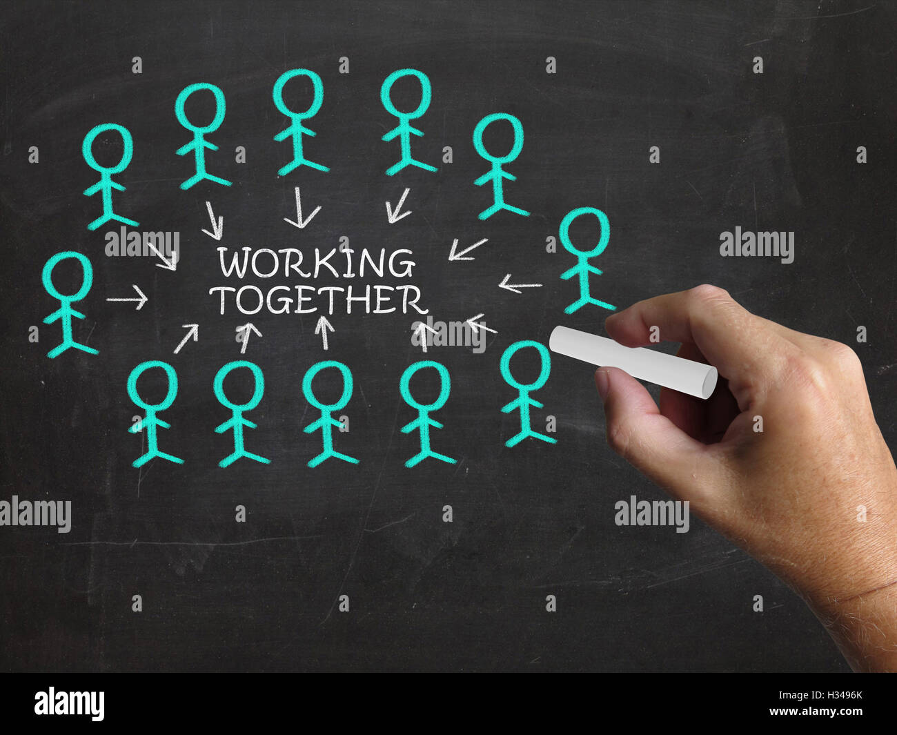Working Together On Blackboard Means Teamwork And Unity Stock Photo - Alamy