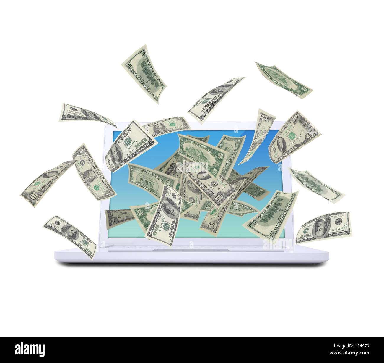 Dollar notes flying around the laptop Stock Photo - Alamy